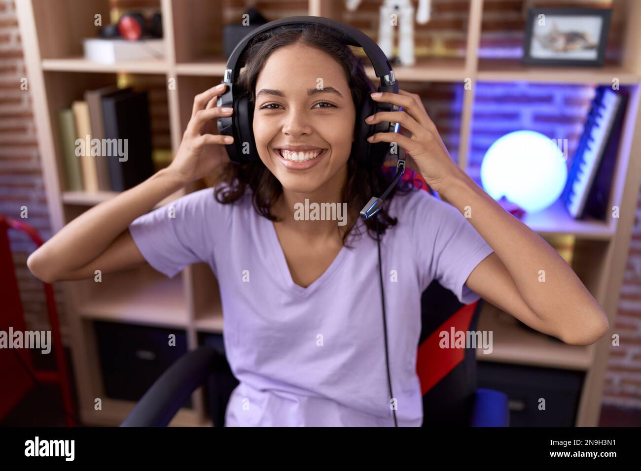 Young african american woman streamer smiling confident sitting on ...