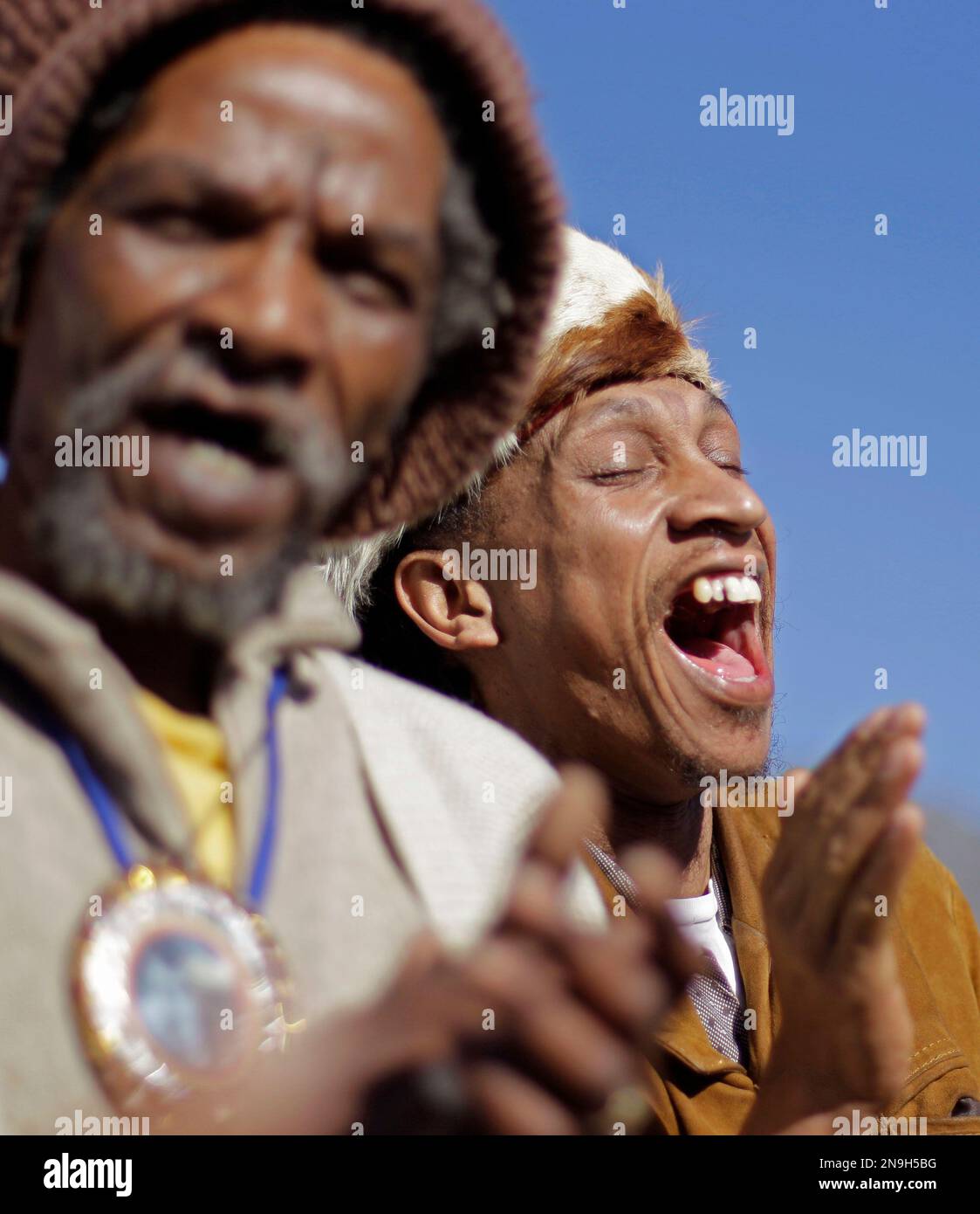 A men form the Khoisan ethnic group sing during a poster unveiling ...