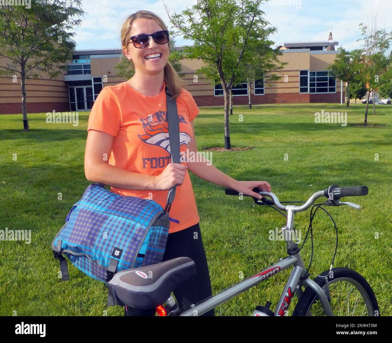 Jaclyn King, 28, smiles as she arrives at her job at a Denver hospital ...
