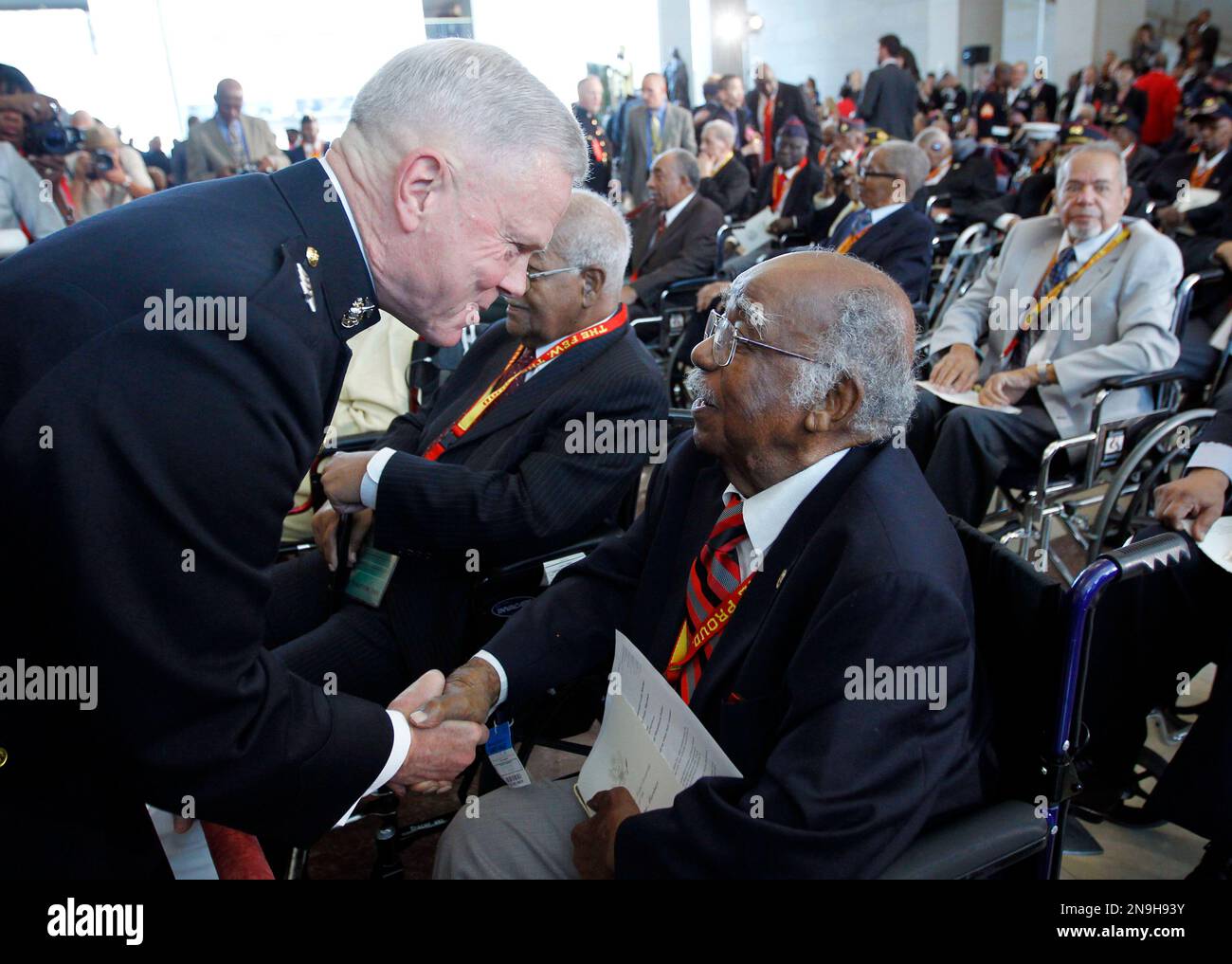 Commandant of the Marine Corps Gen. James F. Amos, left, greets James ...