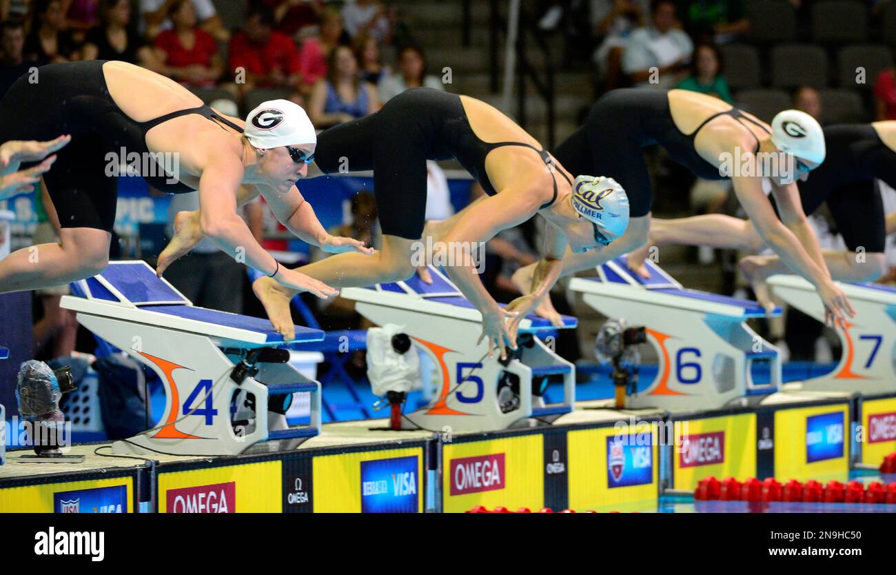 Megan Romano, from left, Dana Vollmer and Chelsea Nauta dive at the ...