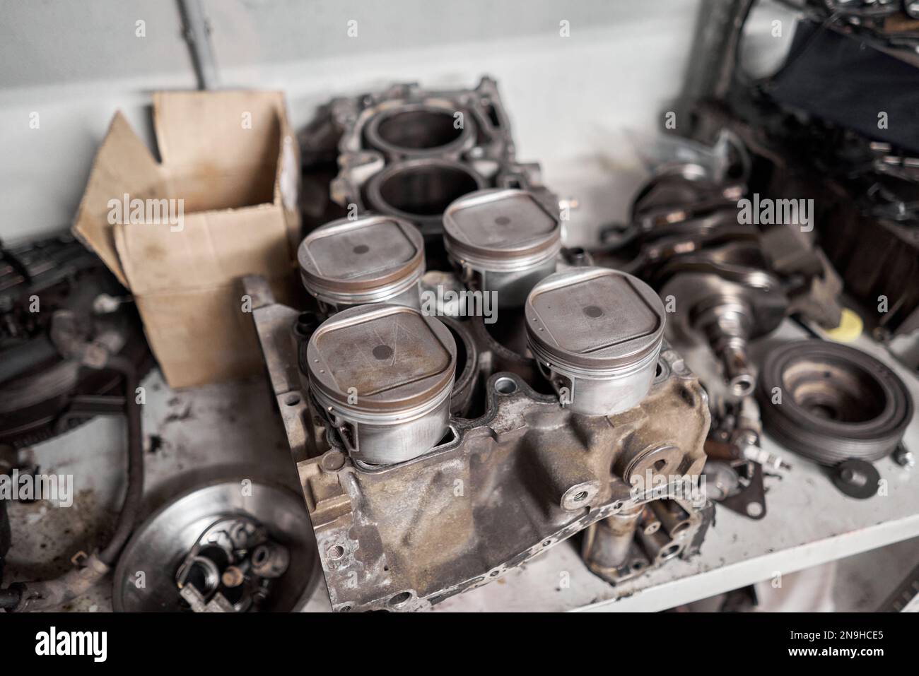 Many tools and auto spare parts car at a car repair shop. Car parts for ...