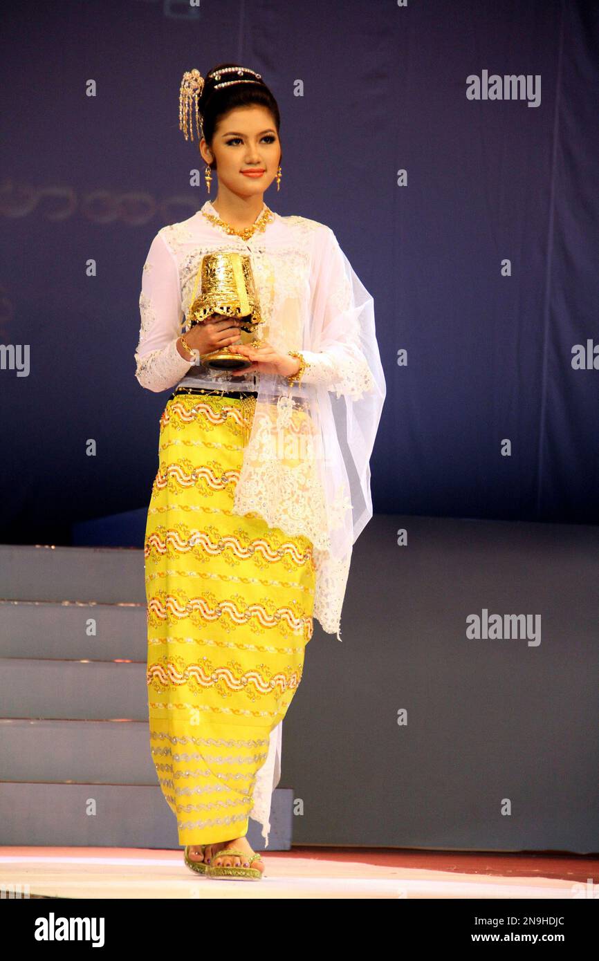 In this photo taken on Tuesday, June 26, 2012, a Myanmar model presents ...