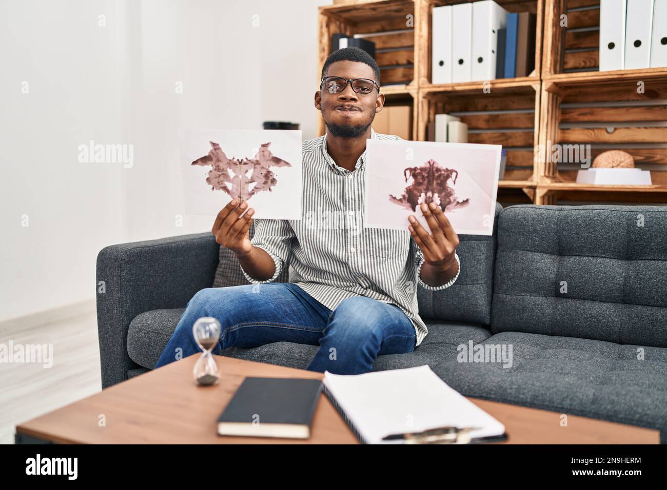 African american man working with rorschach test at psychology clinic ...