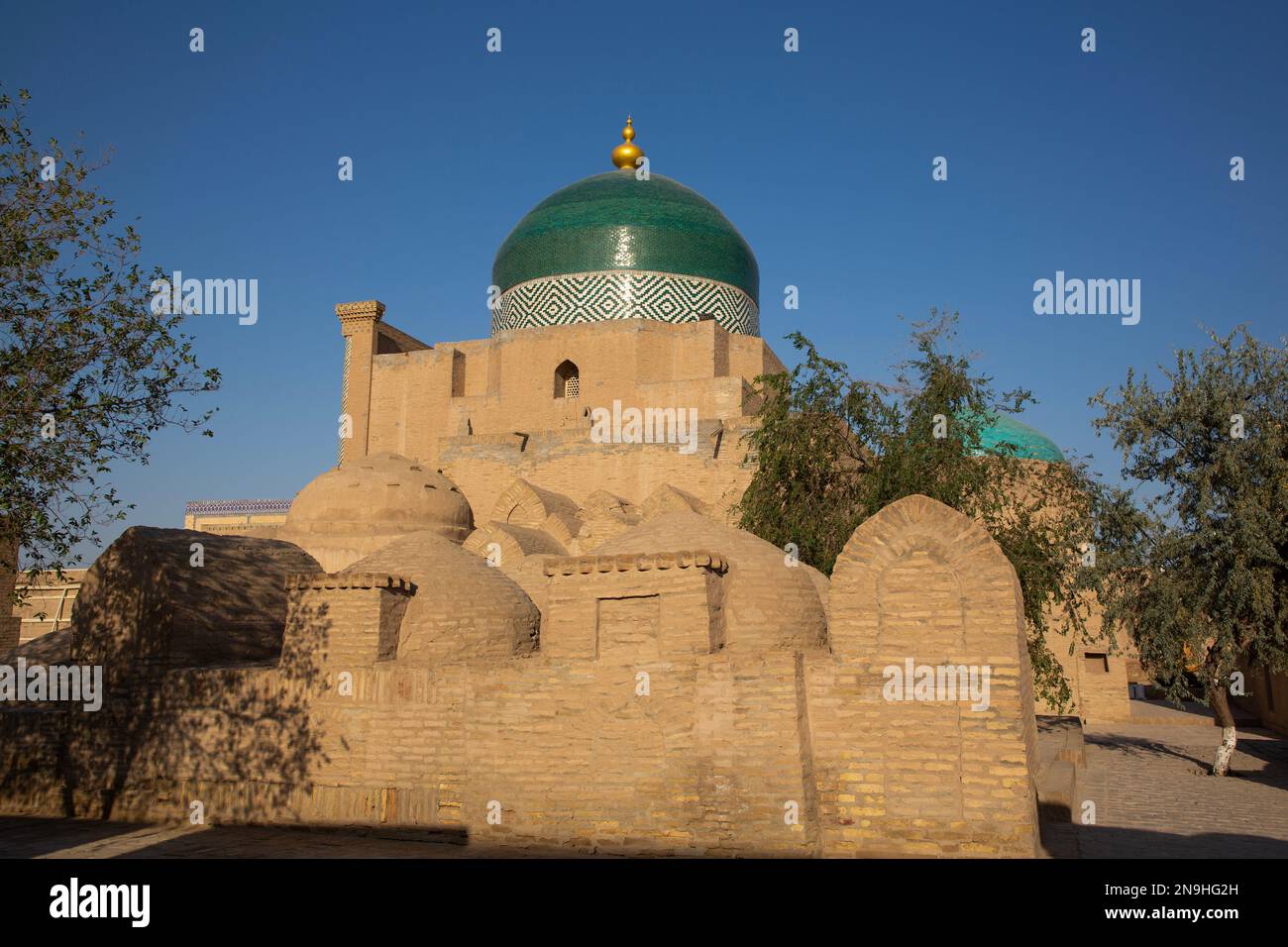 Tombs (foreground), Timurid-style Dome, Pakhlavon Mahmud Mausoleum ...