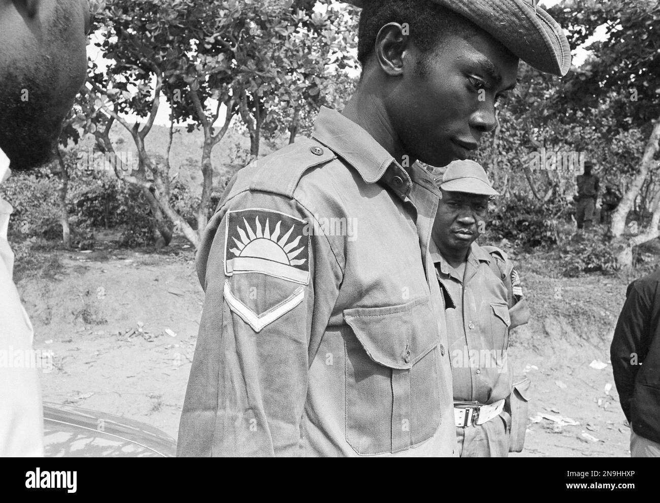 A Biafran soldier in uniform sports a yellow rising sun arm patch, June ...