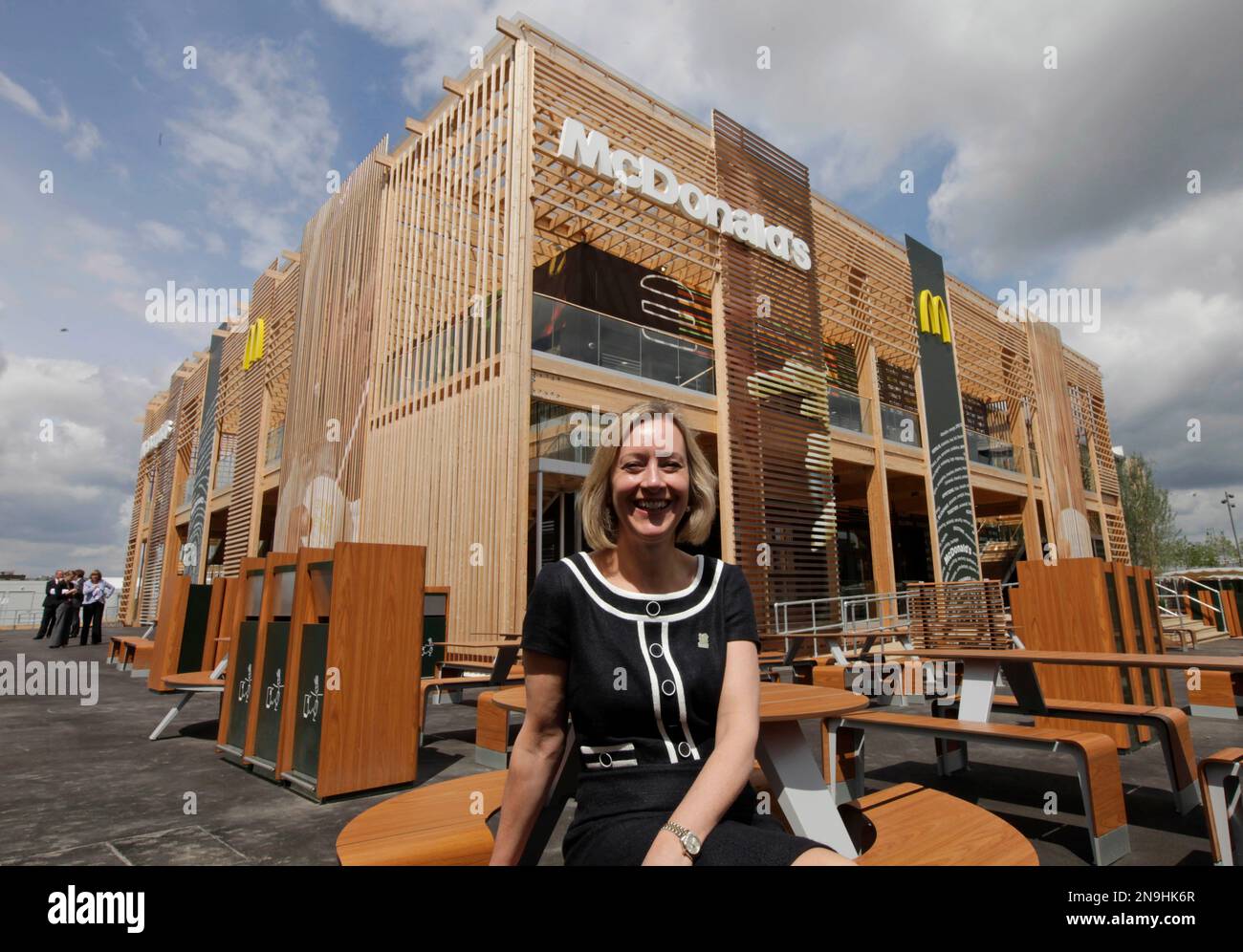 Jill McDonald, CEO of McDonald's UK, backdropped by the newly ...