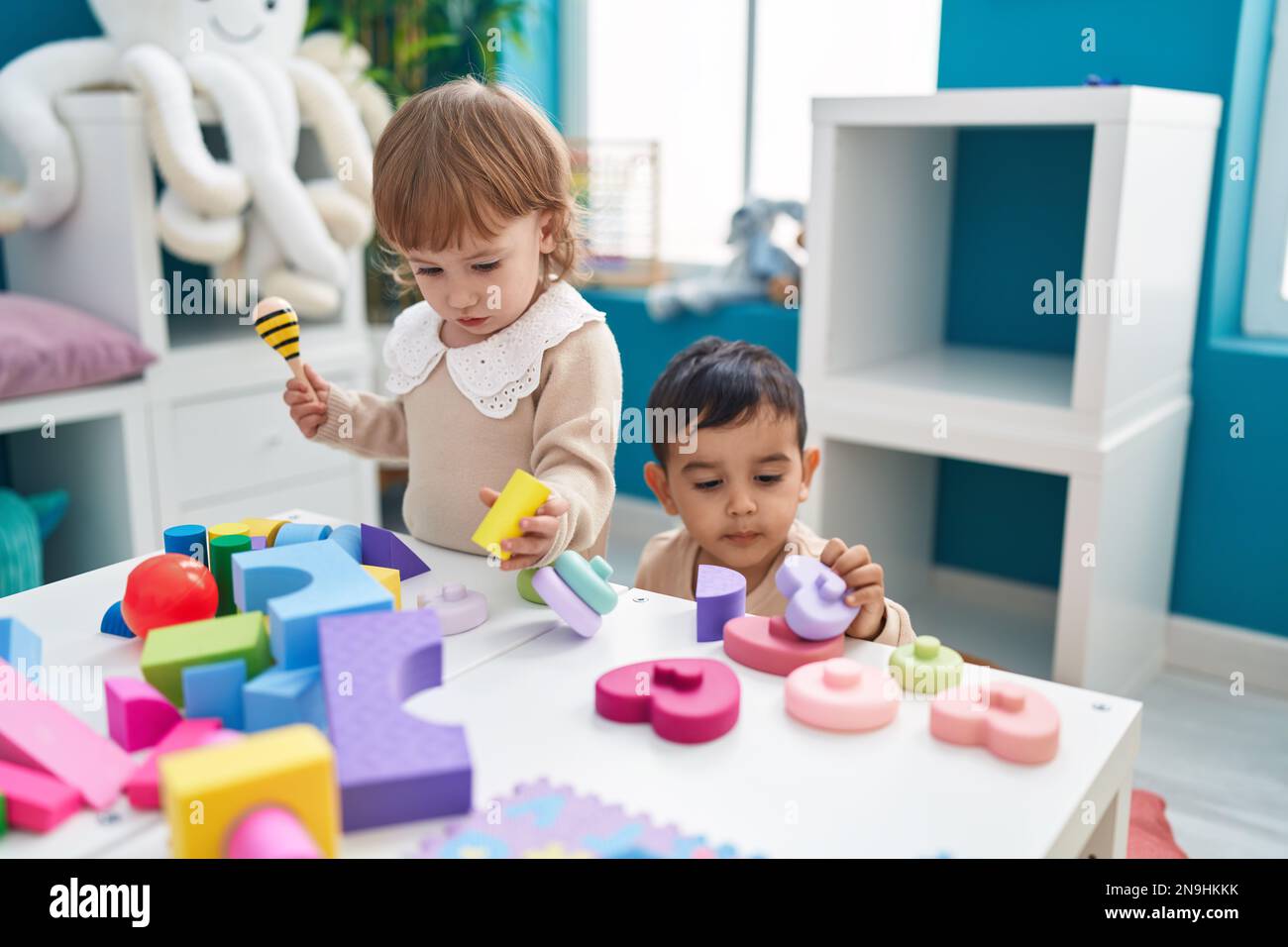Hispanic kids playing with blocks hi-res stock photography and images ...