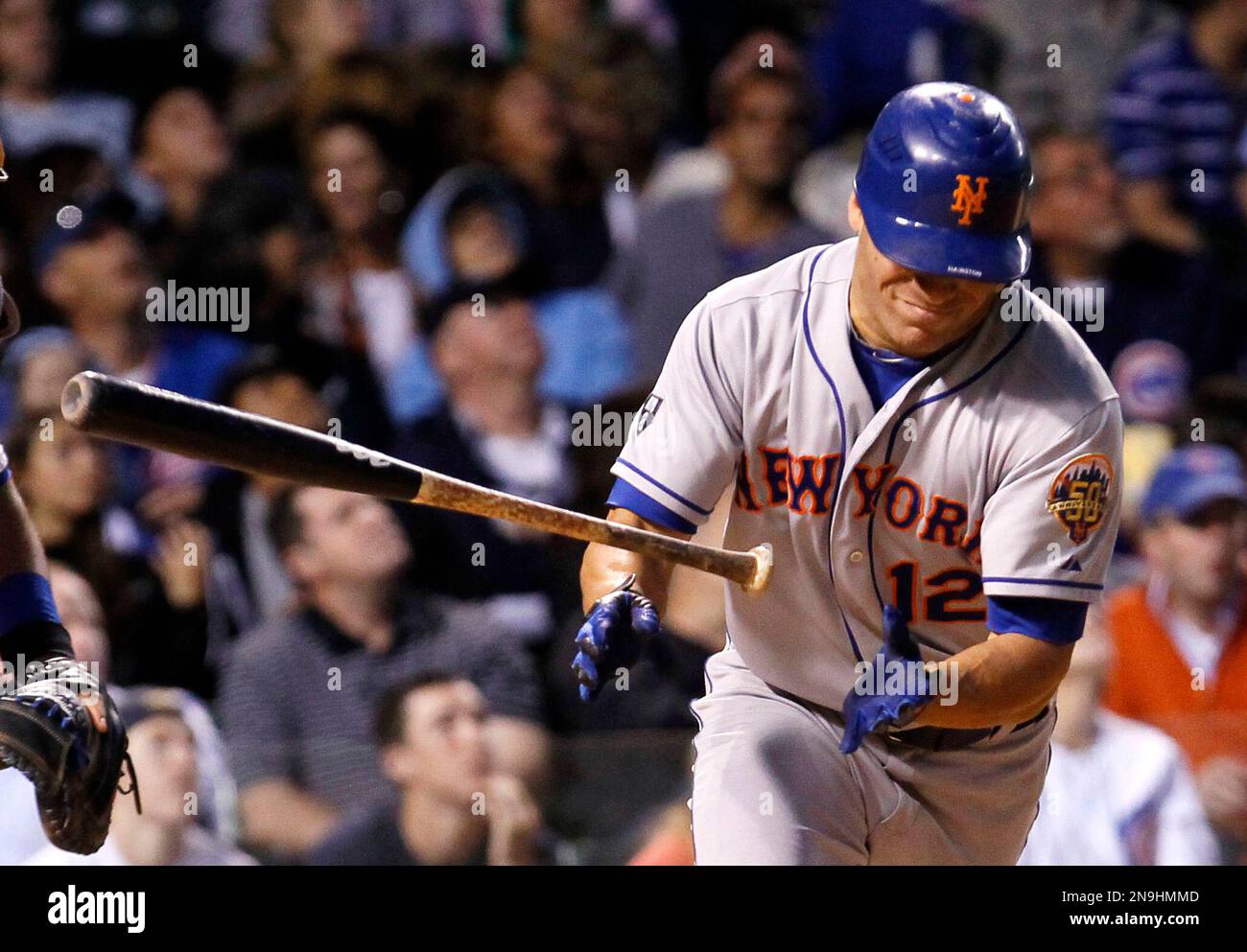 New York Mets' Scott Hairston tosses his bat aside after popping out to ...