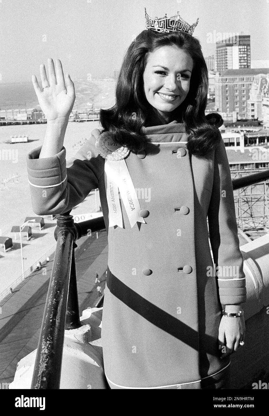 Twenty-one year old Phyllis George of Denton, Texas, waves against ...