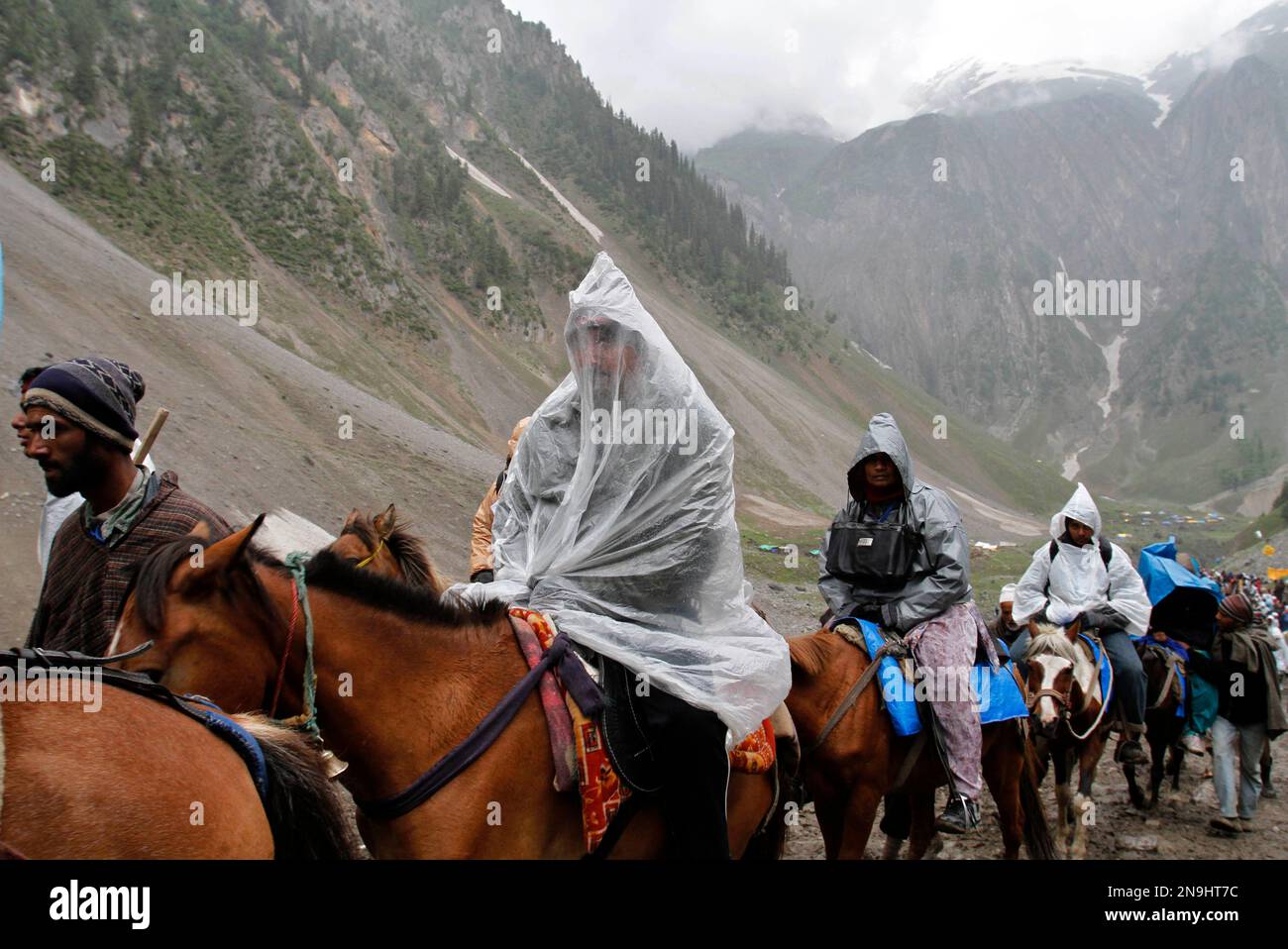 Hindu pilgrims ride their way to the Amarnath cave, near Baltal, 125 ...