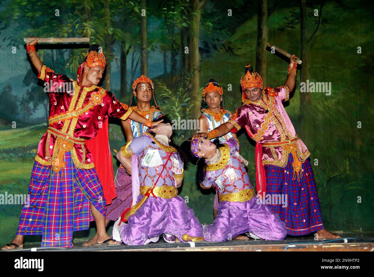 Myanmar traditional artist troupe performs during a ceremony to mark ...