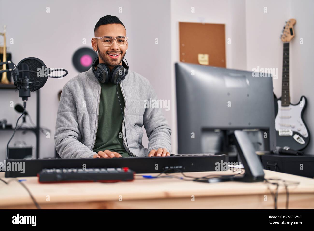 African american man musician playing piano keyboard at music studio ...