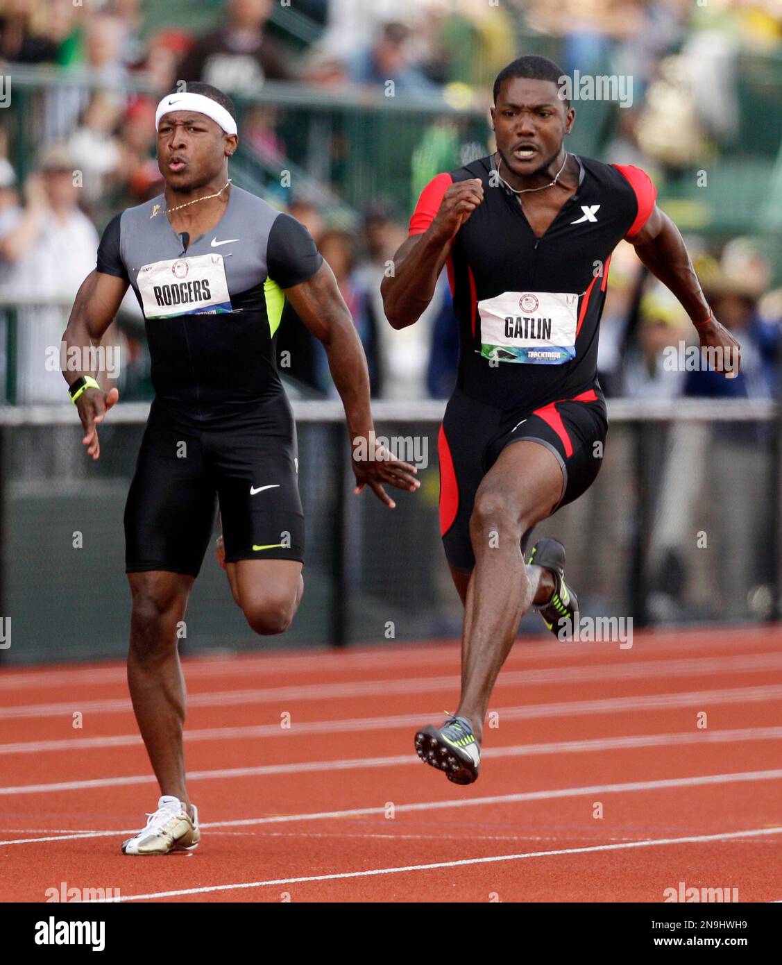 Justin Gatlin runs past Michael Rodgers in men's 100m finals at the U.S ...