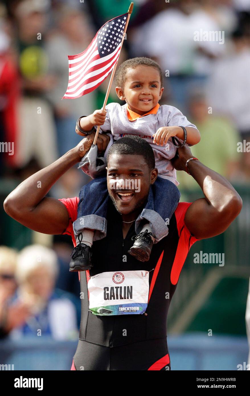 Justin Gatlin celebrates with his son Jace after winning the men's 100m ...