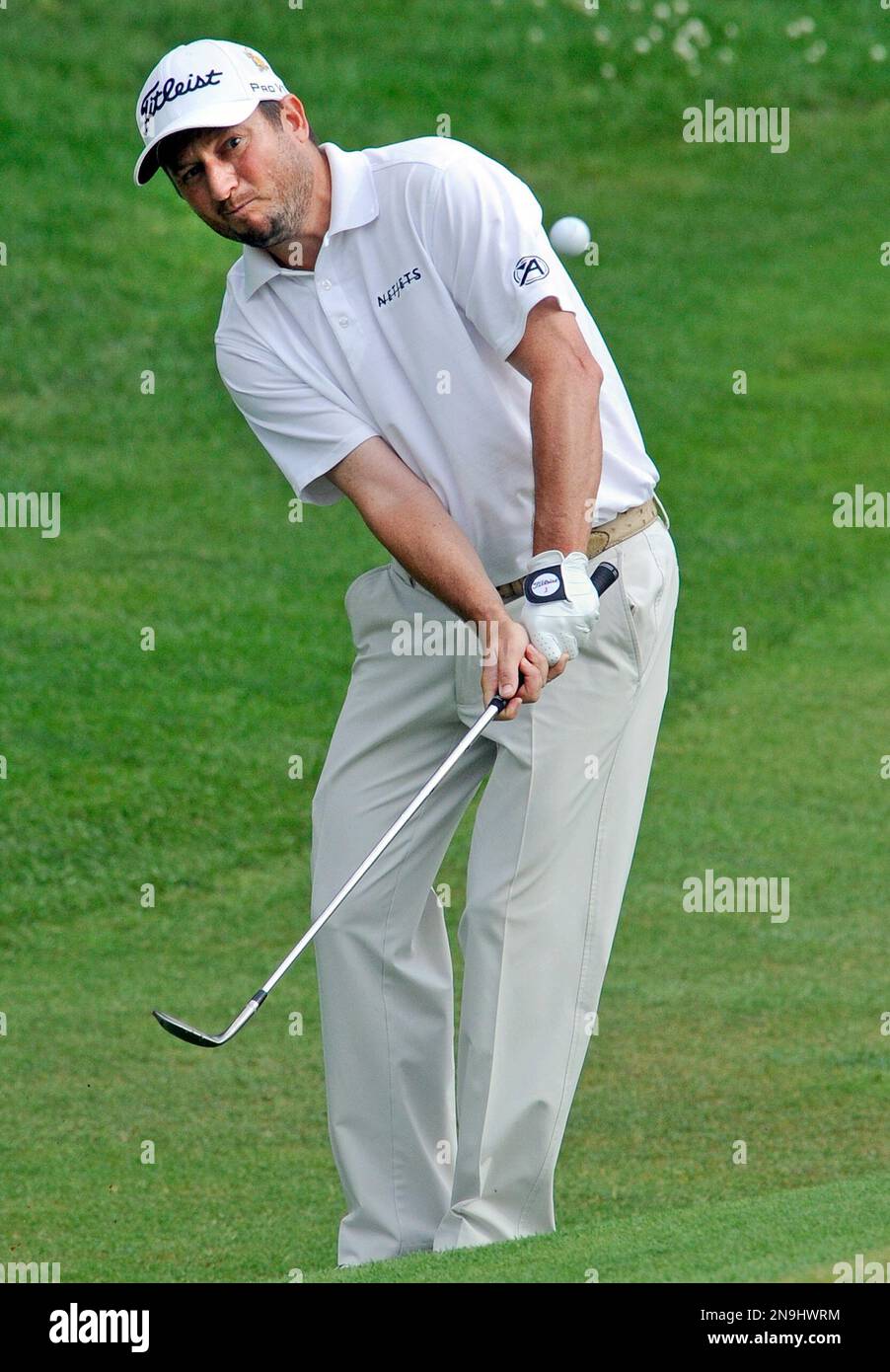 Tim Clark chips onto the 15th green during the final round of the ...