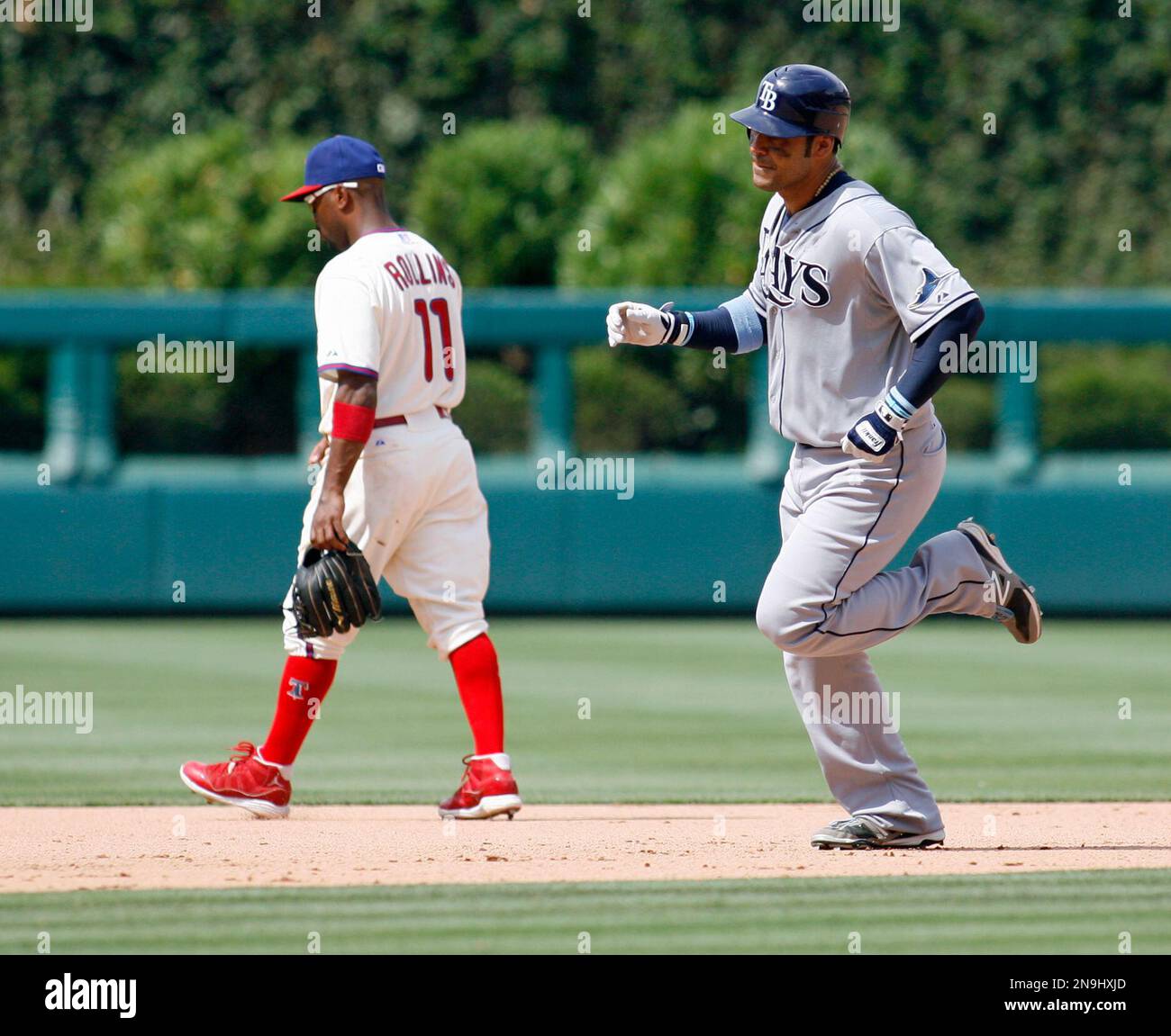 Tampa Bay Rays' Carlos Pena, right runs the bases after he hit a three ...