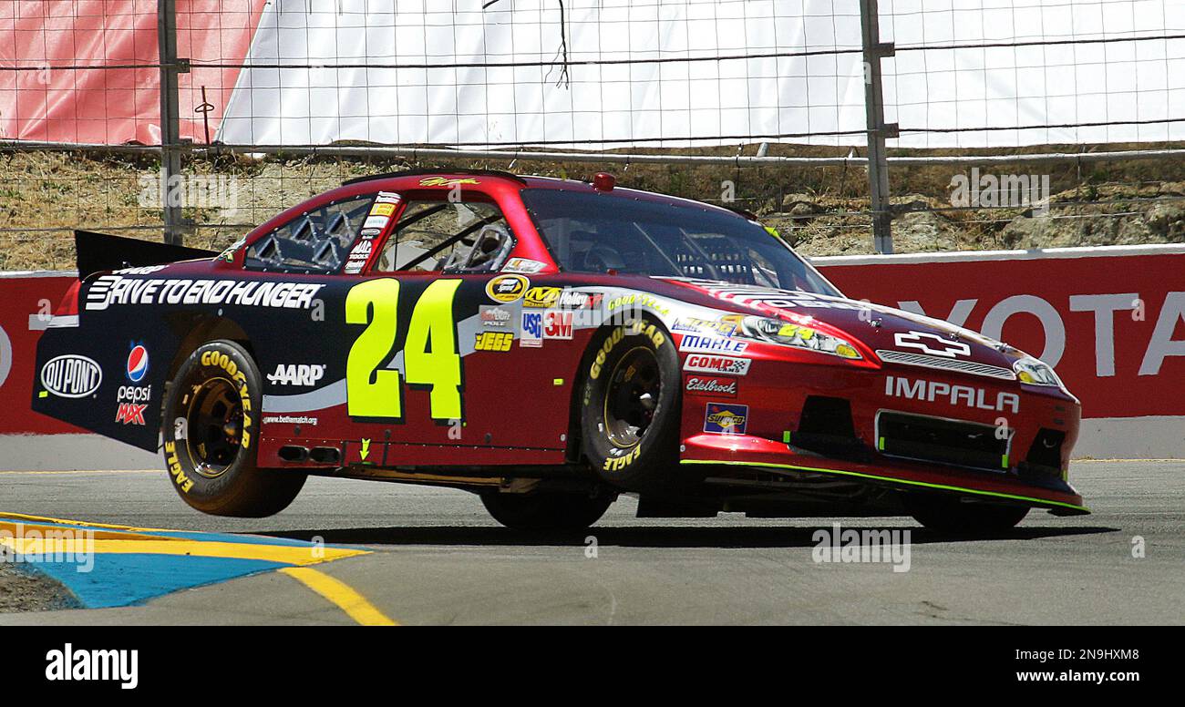 Jeff Gordon takes a curve on two wheels during the NASCAR Sprint Cup ...