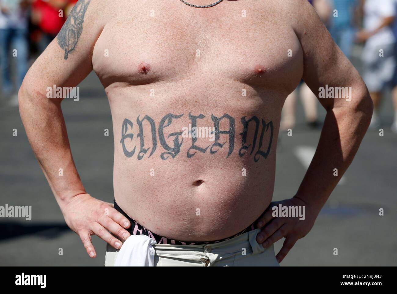 An England fan shows his England tattoo in the fan zone in Kiev ...