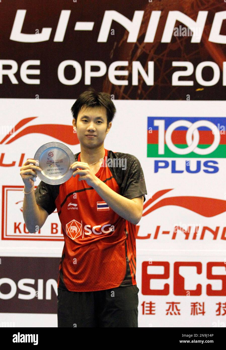 Thailand's Boonsak Ponsana holds a trophy for photo after winning men's ...