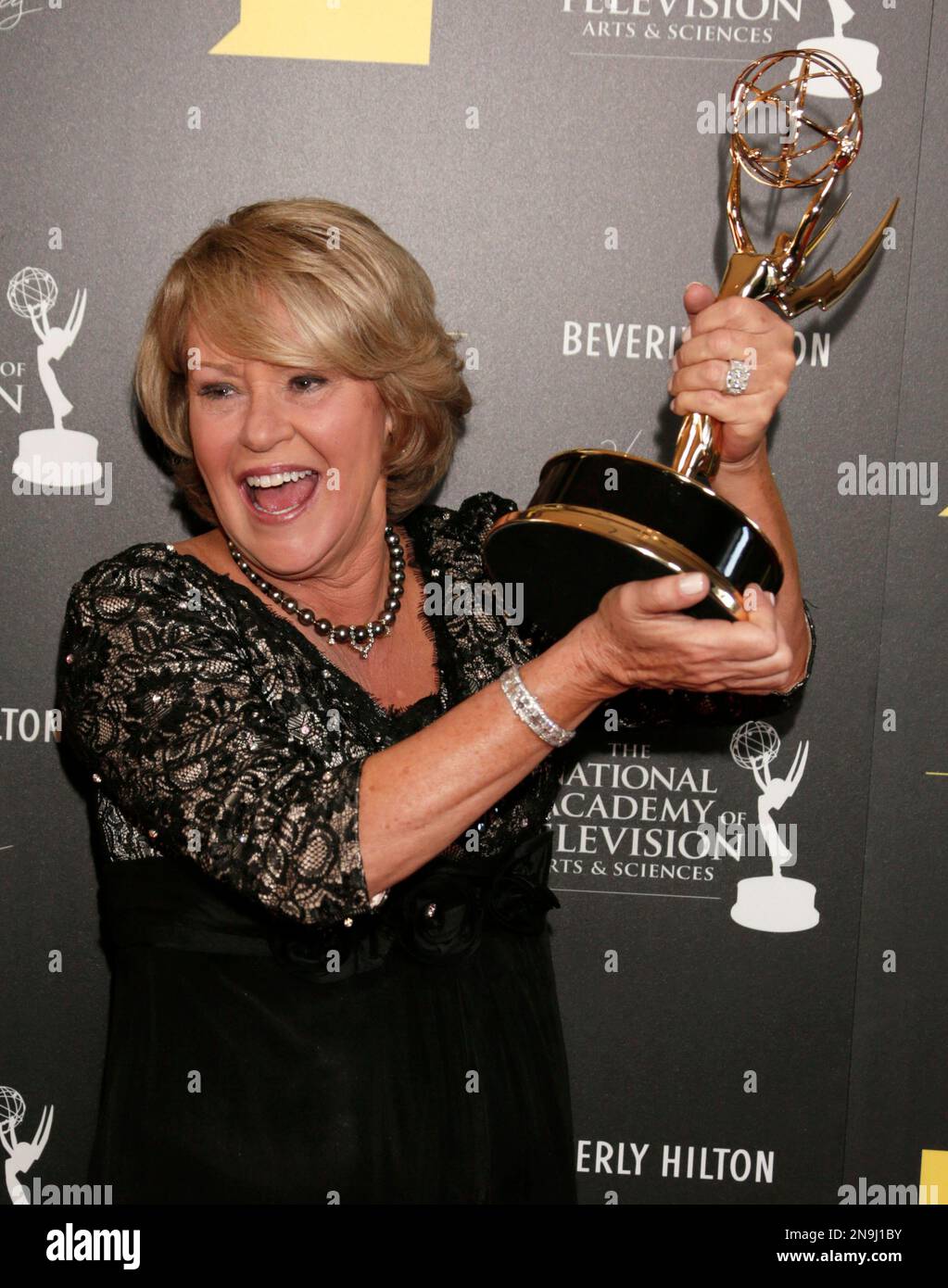 Mary Ann Gunn poses backstage with the award for legal/courtroom ...