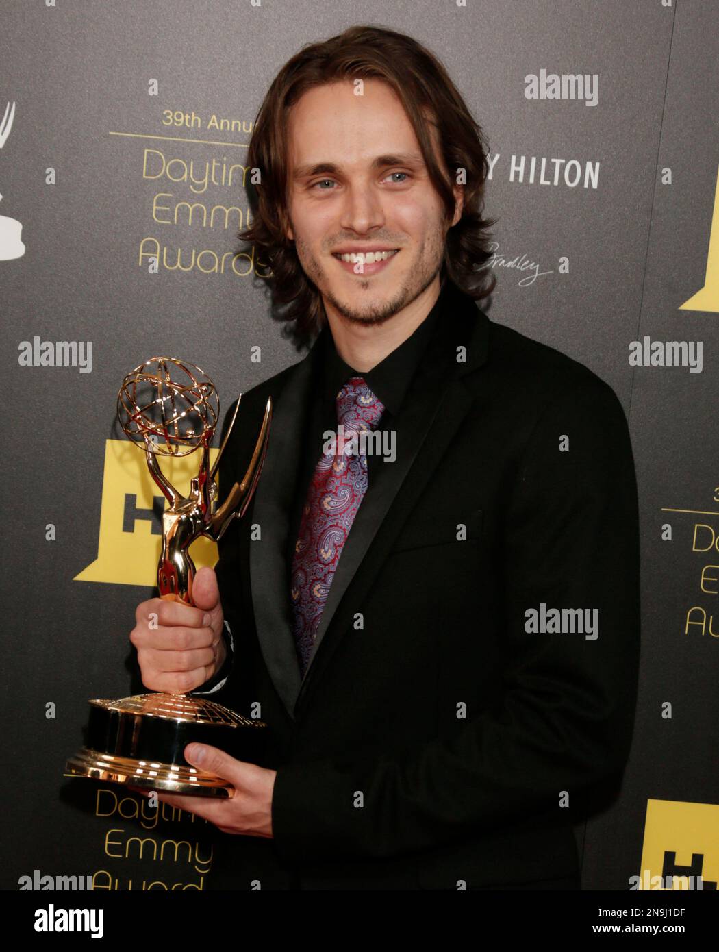 Jonathan Jackson poses backstage with the award for supporting actor in ...