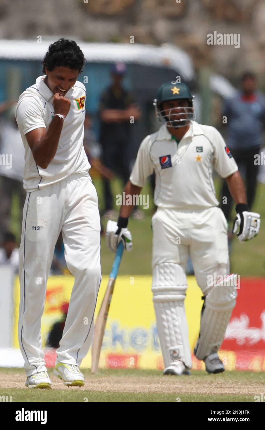 Sri Lanka's bowler Suraj Randiv, left, celebrates the dismissal of ...