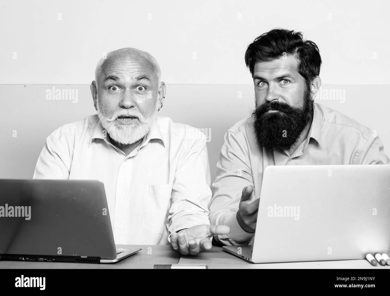 Elderly senior and old handsome teacher with notebook. A grandfather ...