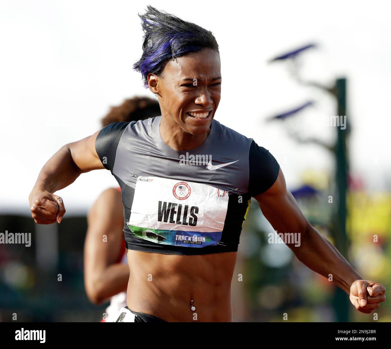 Kellie Wells celebrates after the women's 100m hurdles final at the U.S ...