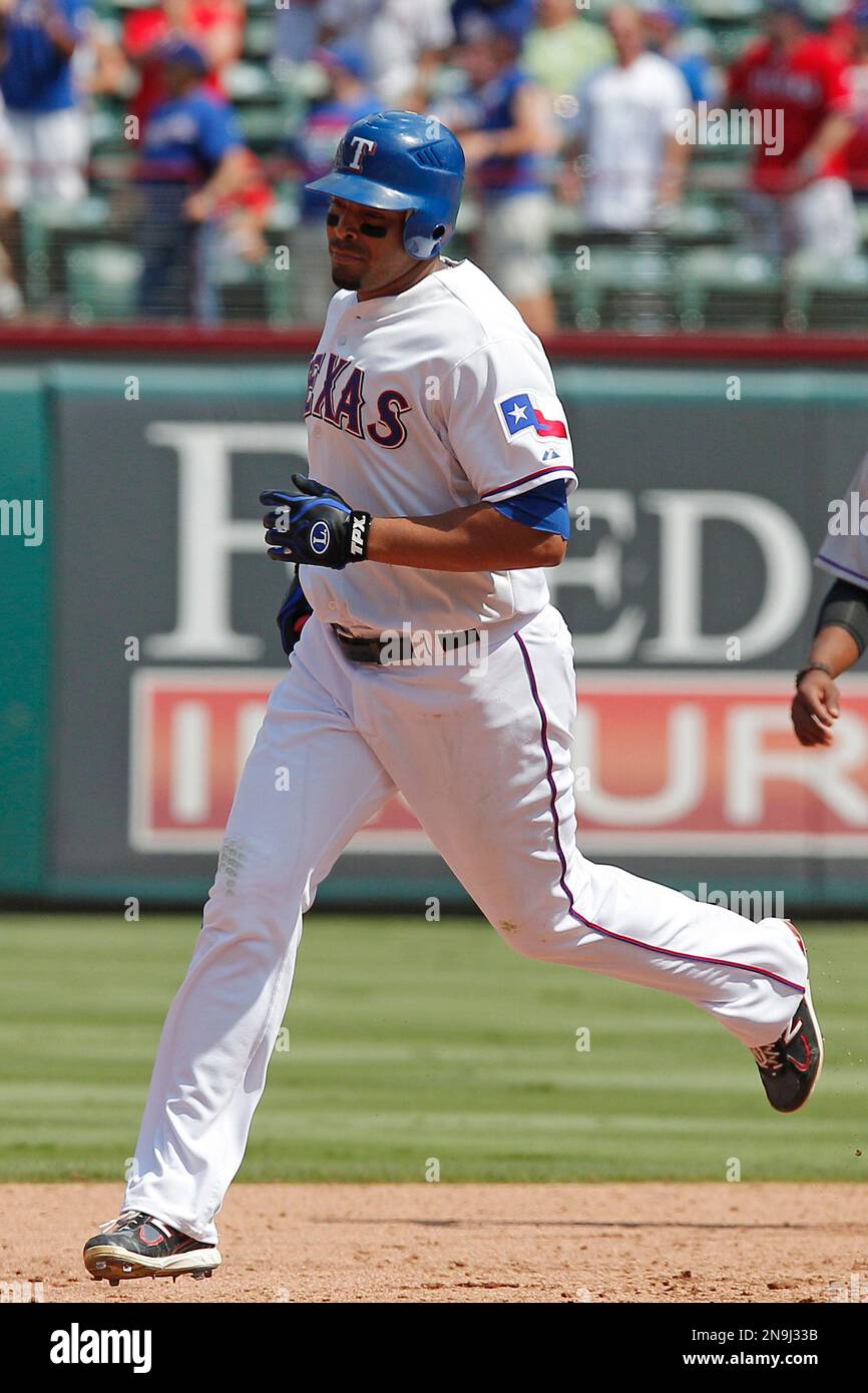 Texas Rangers right fielder Nelson Cruz rounds the bases after htting a ...