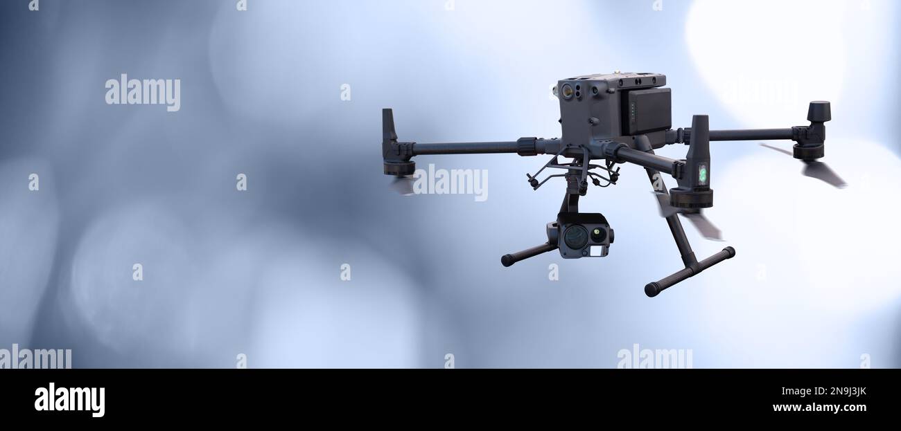 Industrial drone with camera on a blurred gray background Stock Photo ...
