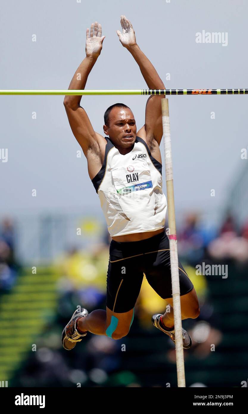 Bryan Clay clears the bar while pole vaulting during the decathlon ...