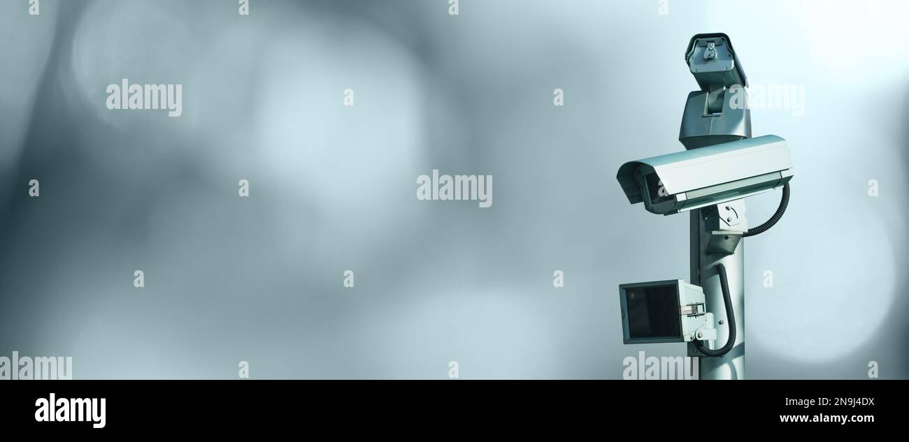 Security camera on a green background Stock Photo - Alamy