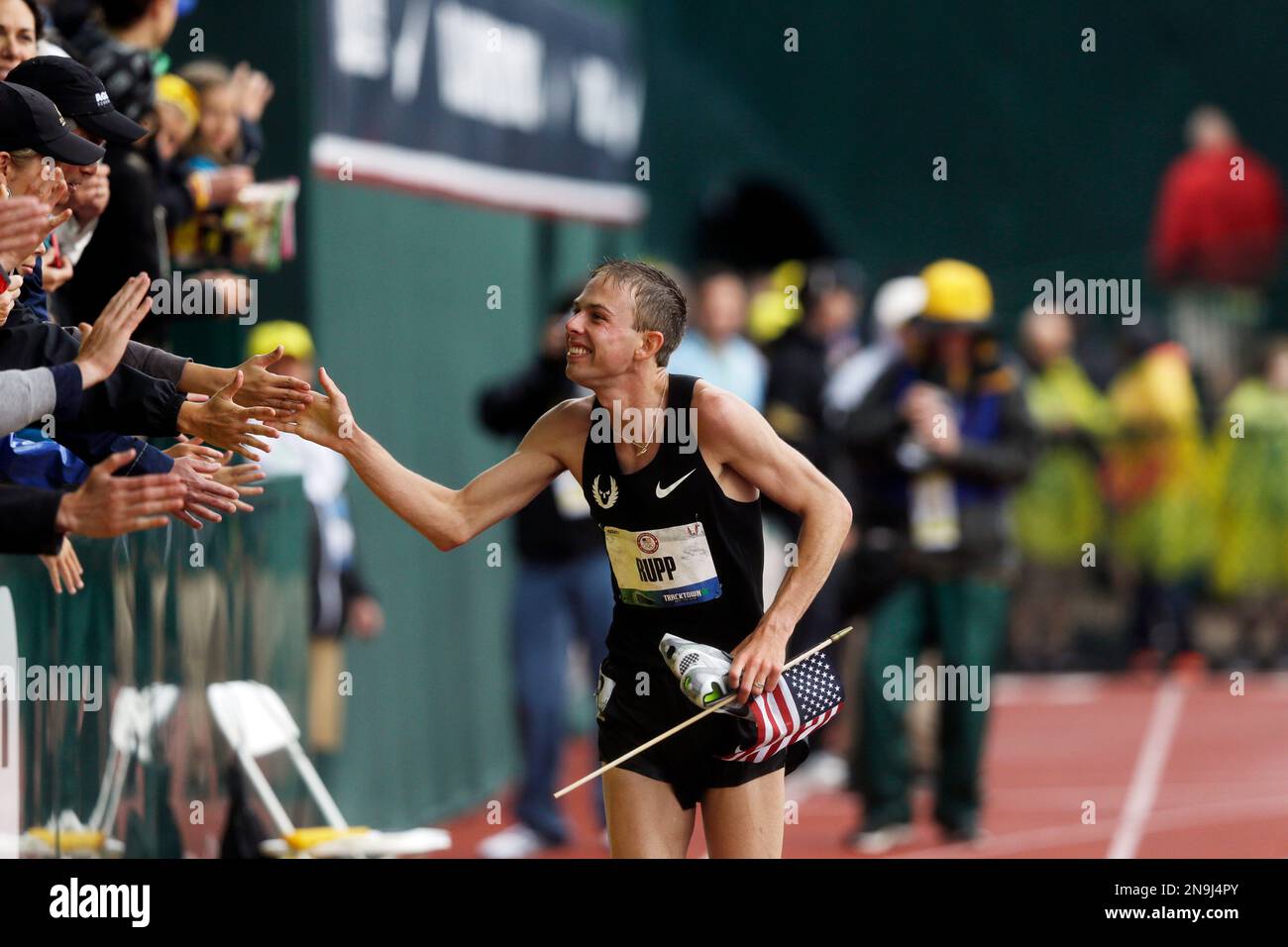 Galen Rupp reacts after finishing the men's 10,000m finals at the U.S ...