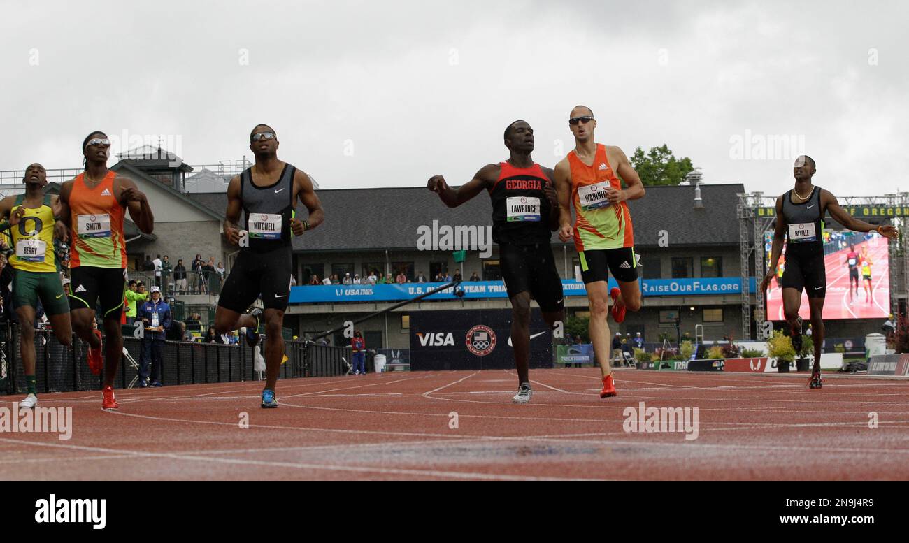 Runners cross the finish line in a men's 400m preliminary at the U.S ...