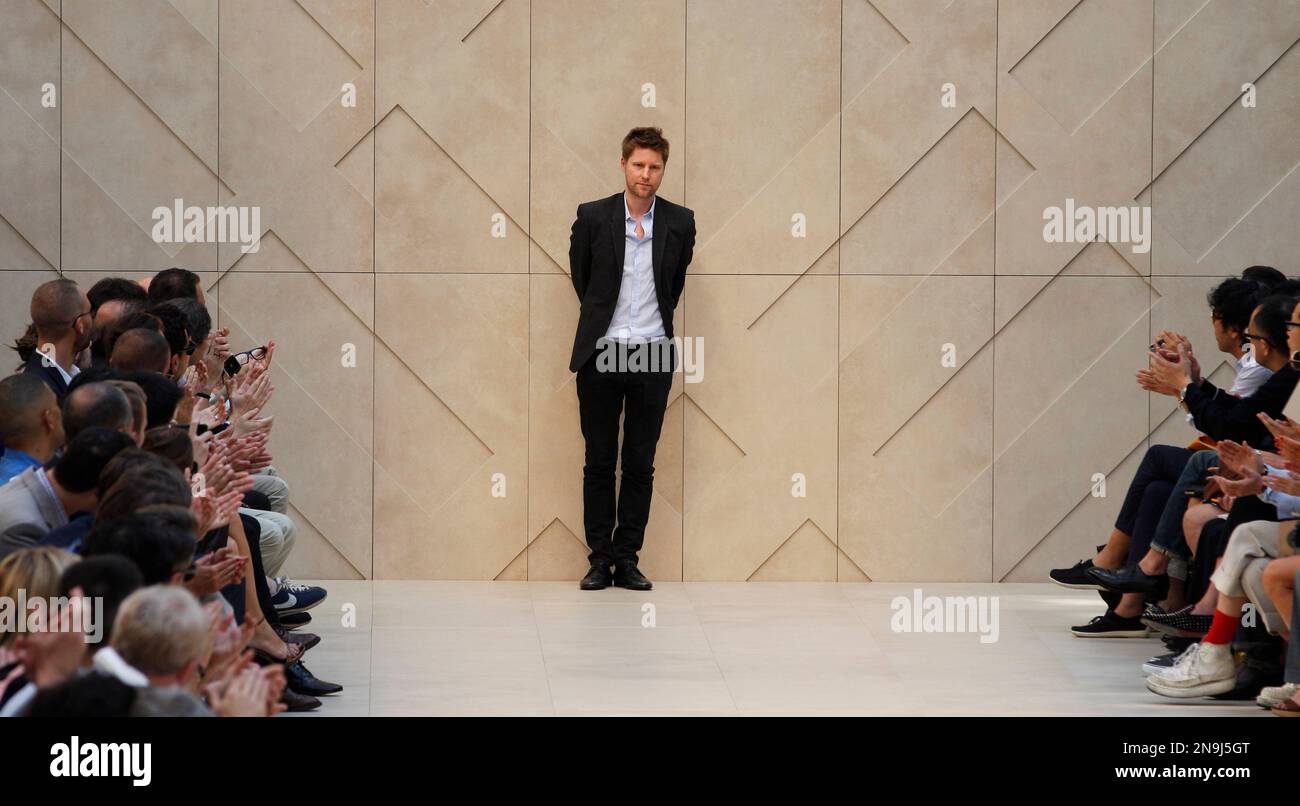 British fashion designer Christopher Bailey receives applause from the ...