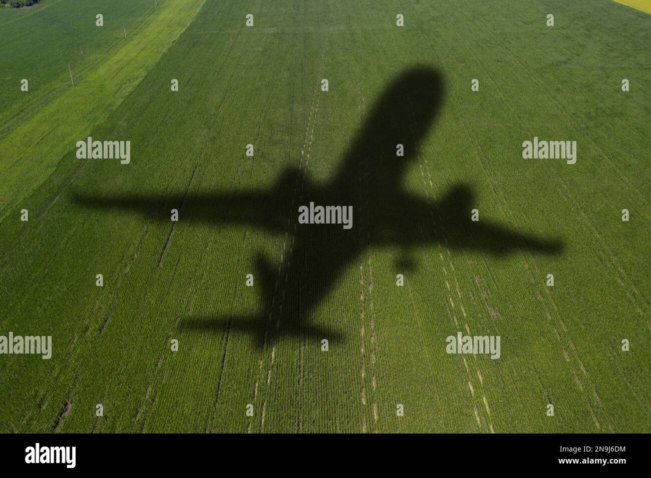 Shadow of the plane on the agricultural field. Concept of ...