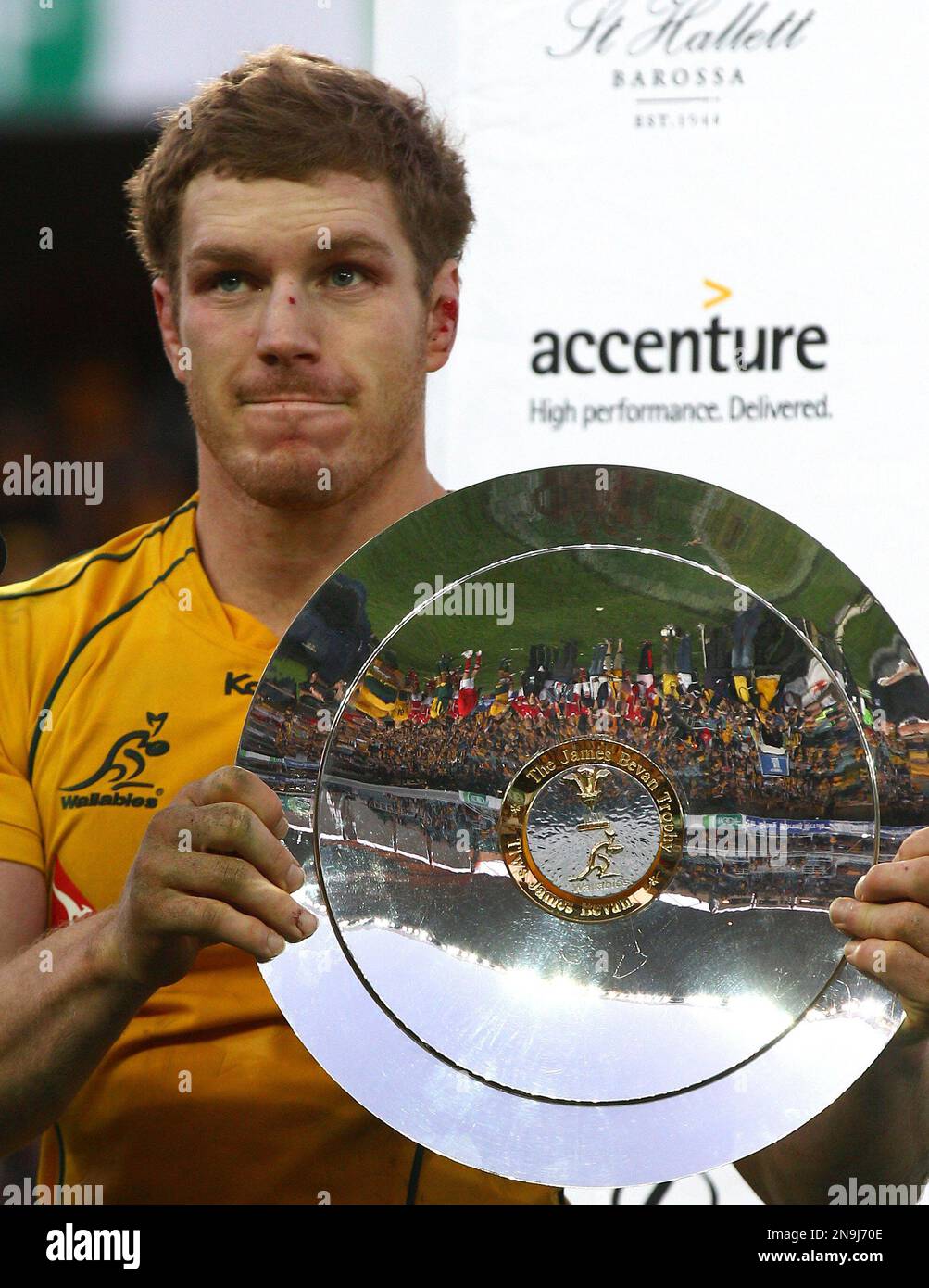 Australia's captain David Pocock holds the James Bevan Trophy after ...