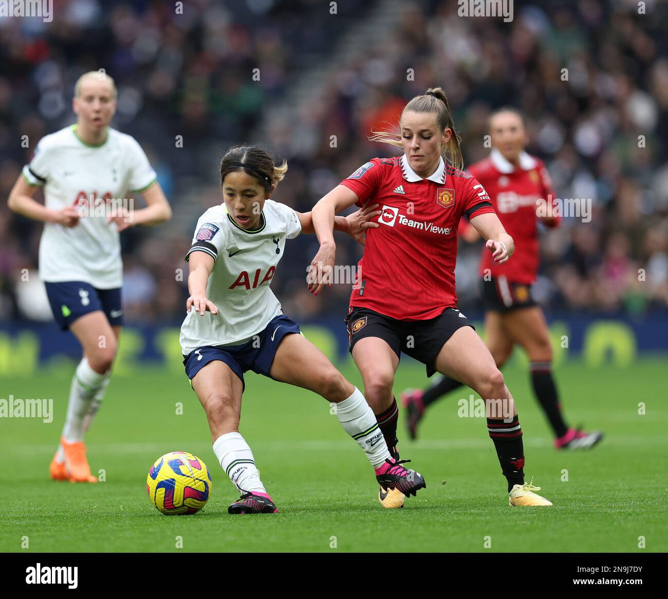 London, UK. 12th Feb, 2023. Mana Iwabuchi of Spurs women with Ella Toone of Man Utd women during ...