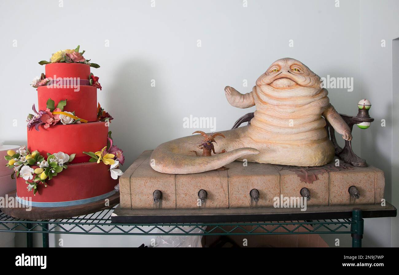 In this image taken on Wednesday, June 20, 2012, a tiered cake with ...