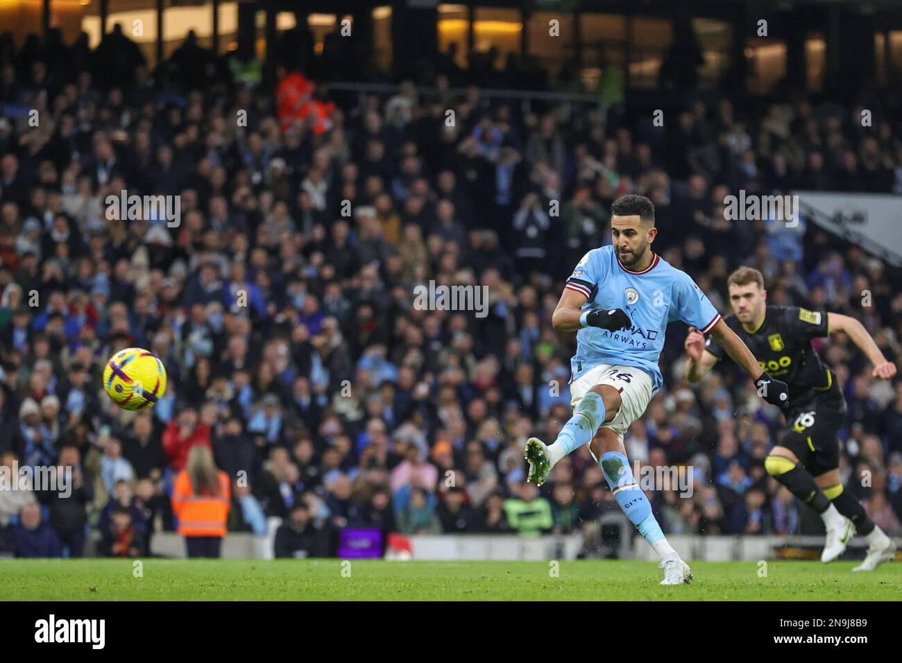 Riyad Mahrez #26 of Manchester City scores a goal to make it 3-0 during ...