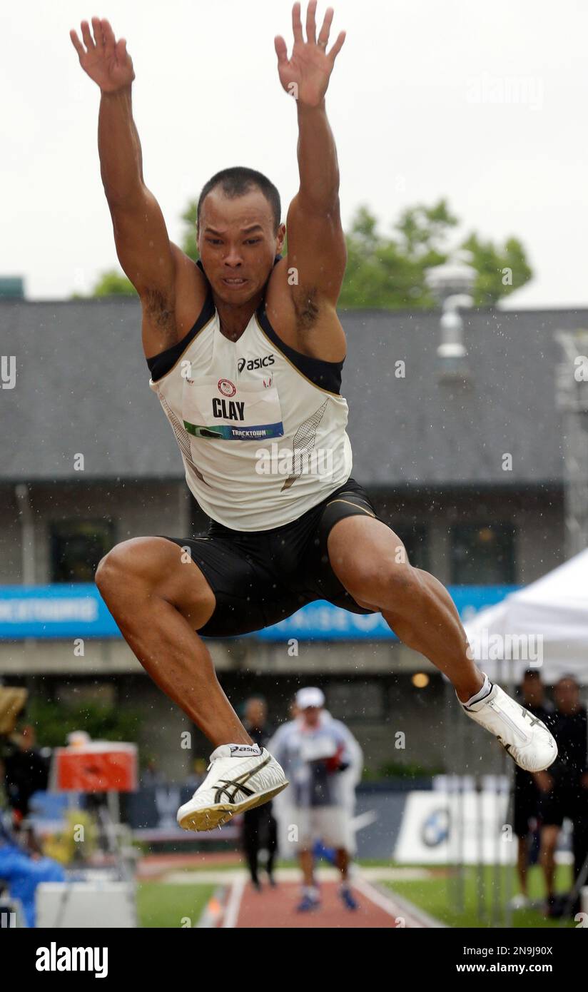 Bryan Clay participates in the long jump during the decathlon ...