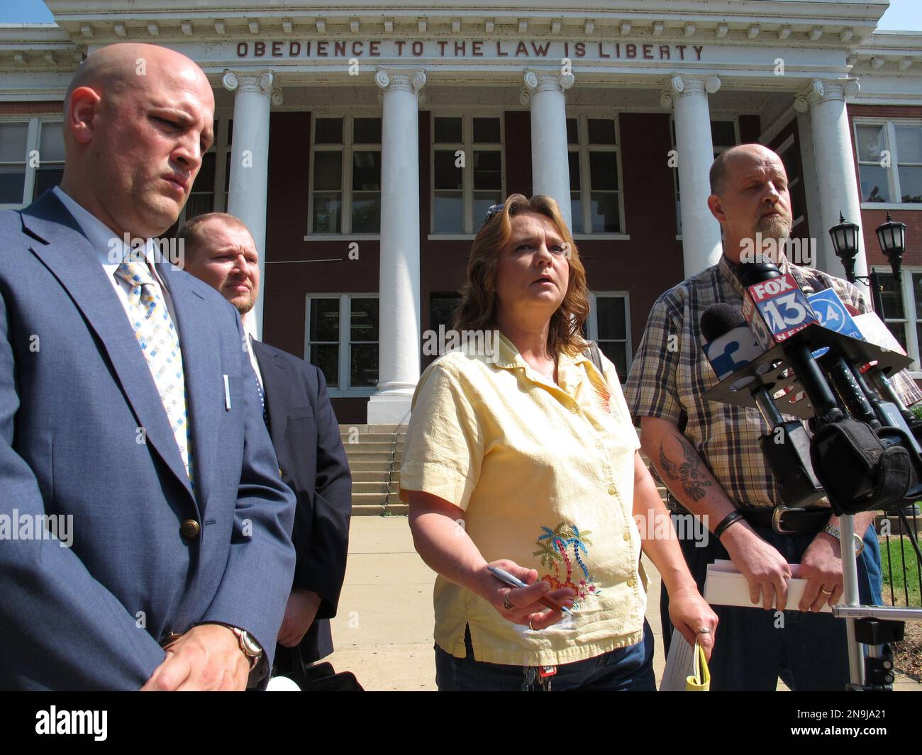 Pam Hicks, center, talks to media outside the Crittenden County ...