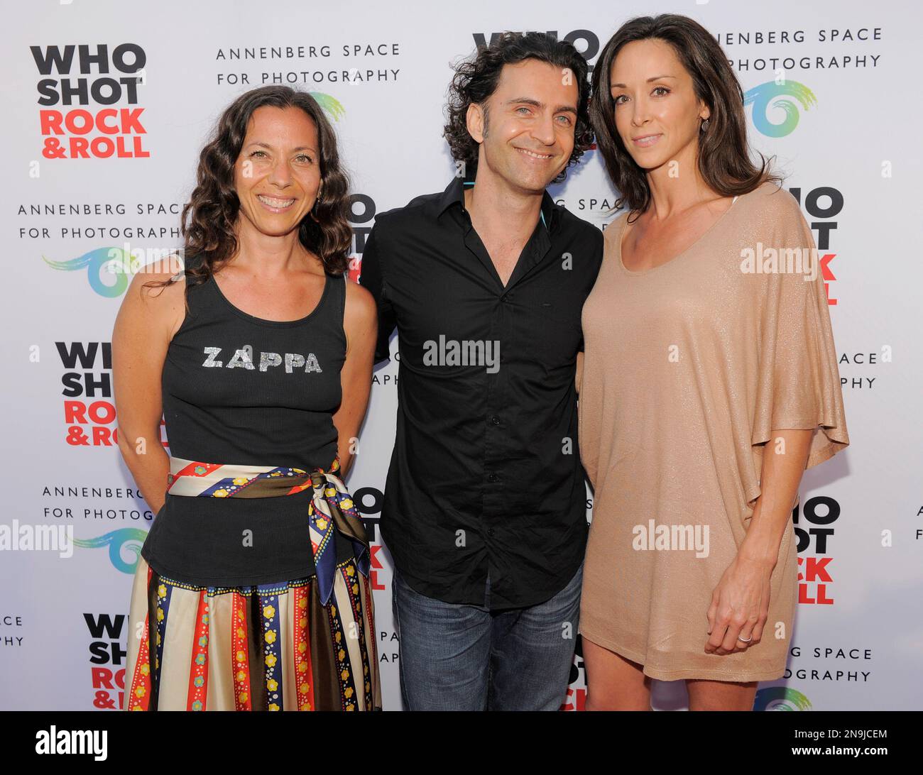 Dweezil Zappa, center, poses with his sister Moon Zappa, left, and his ...