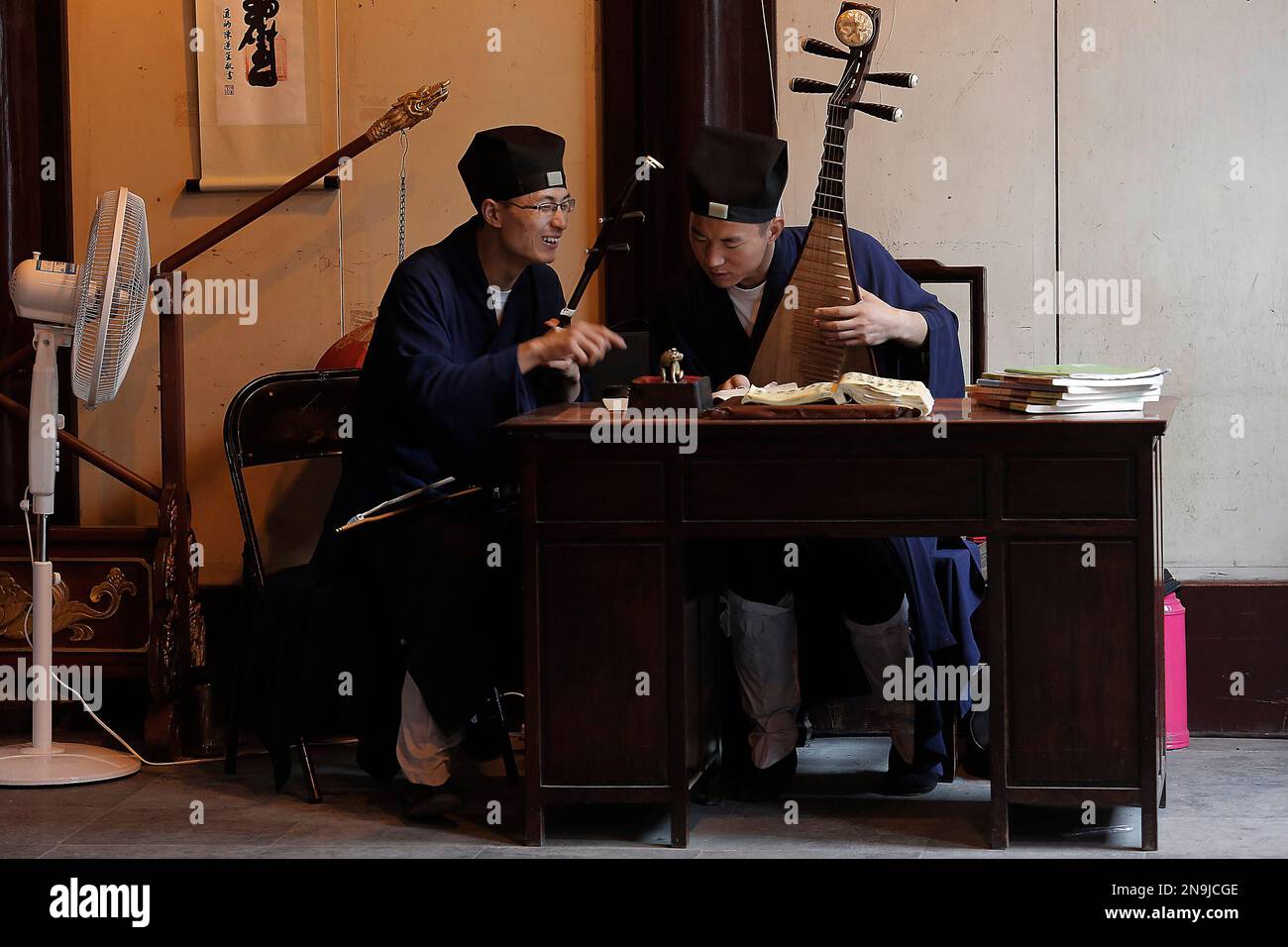 Taoist priests practice the pipa, a Chinese musical instrument, at a ...