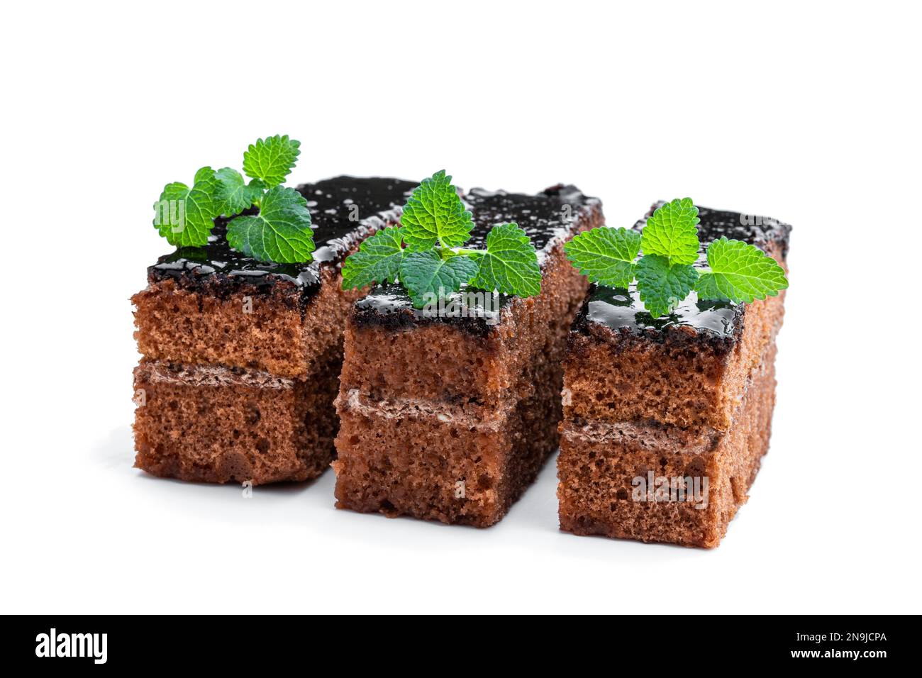 Chocolate cake slices isolated on white Stock Photo - Alamy