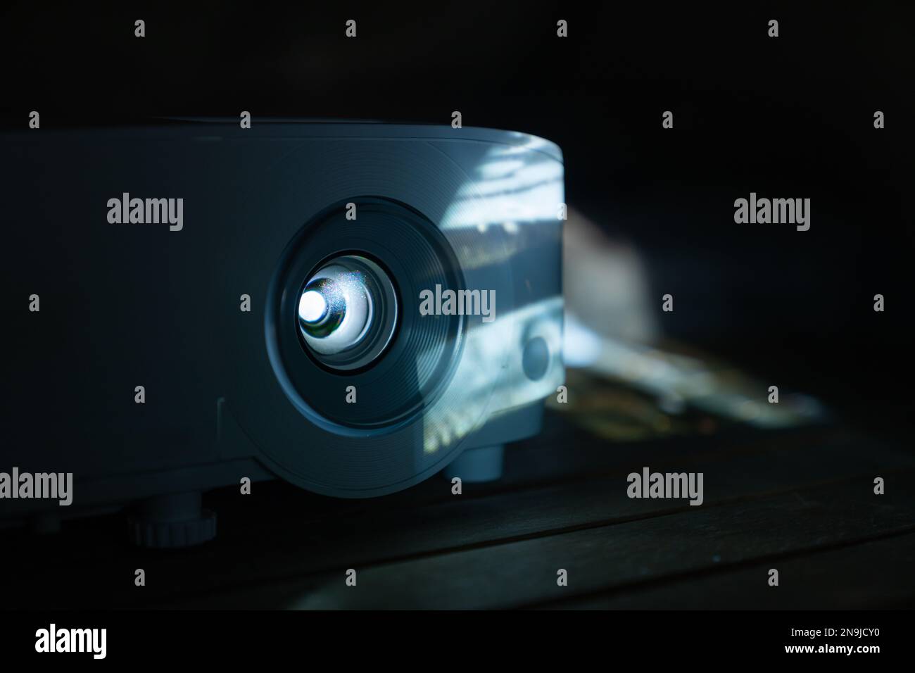 Home theater projector in the dark Stock Photo - Alamy