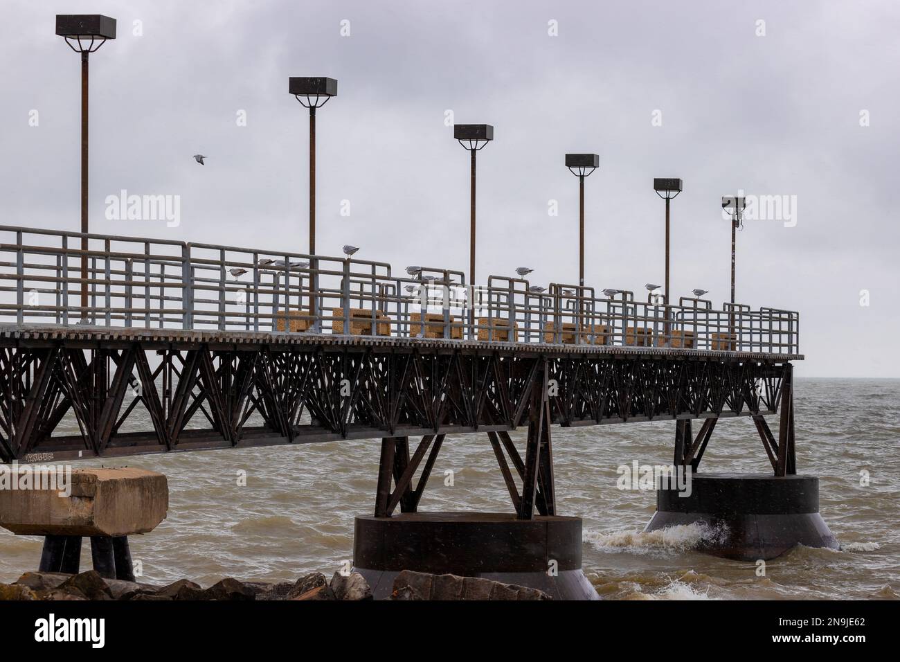 Lake effect snow flurries on a cold and stormy day along the shores of ...