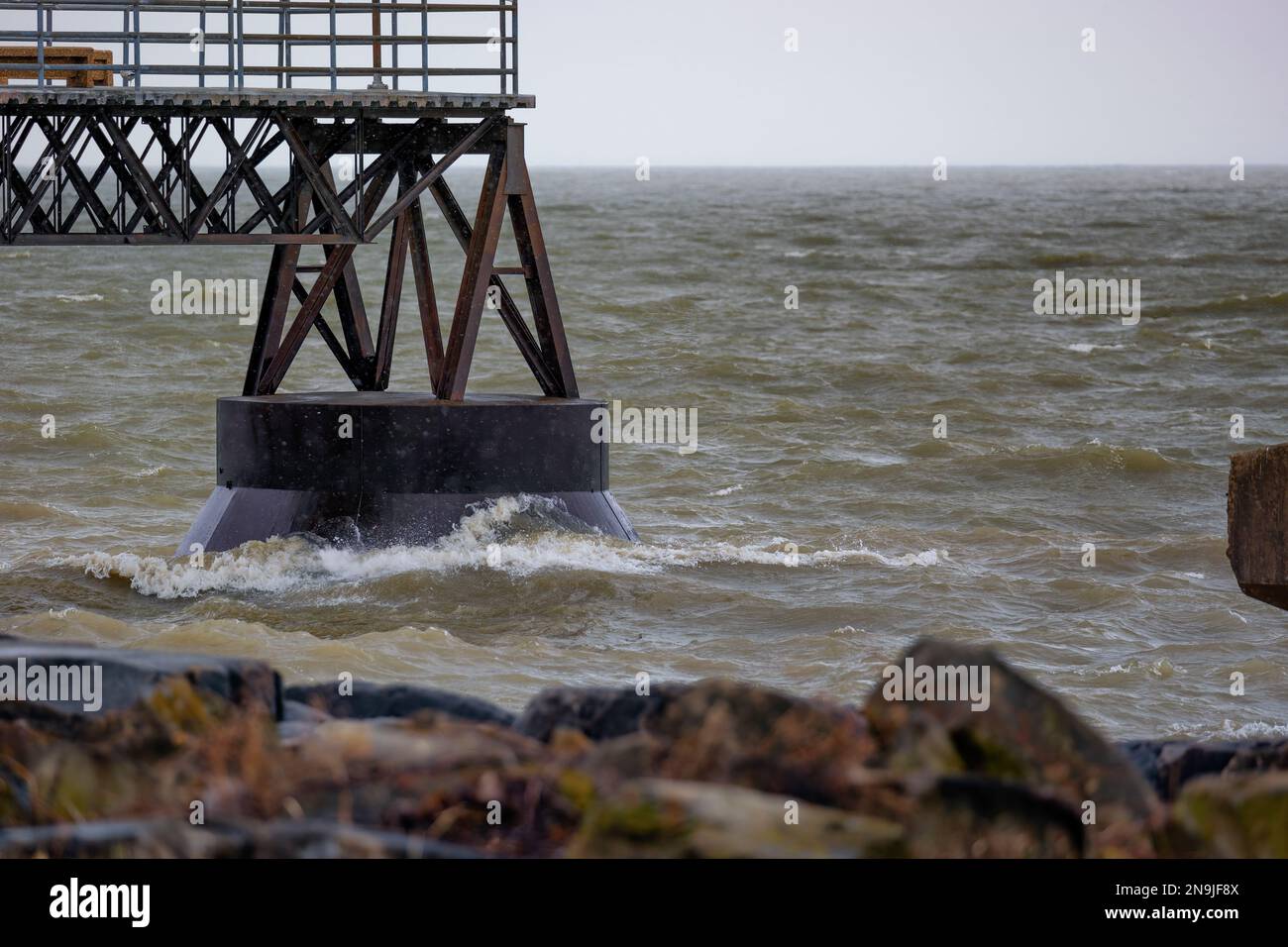 Lake effect snow flurries on a cold and stormy day along the shores of ...