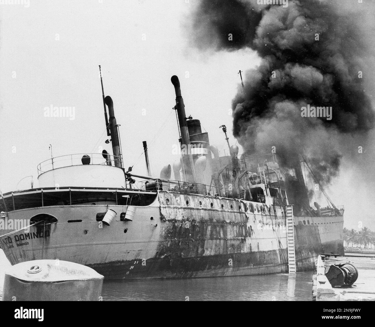 The freighter Santo Domingo burns at dockside in Santo Domingo in the ...